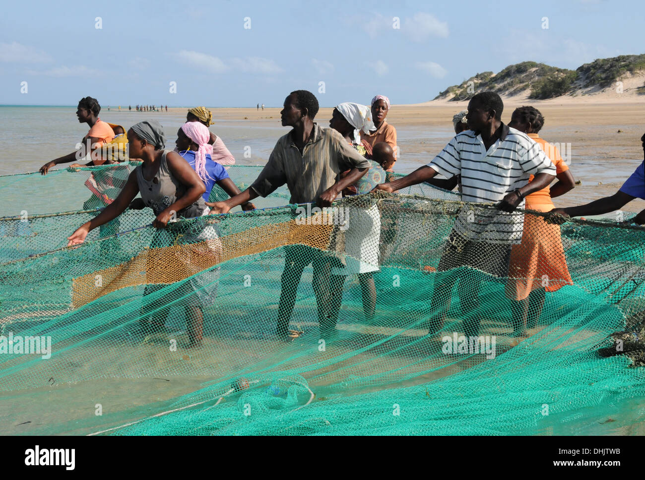 Villagers pulling in fishing nets. Benguerra Island, Bazaruto ...