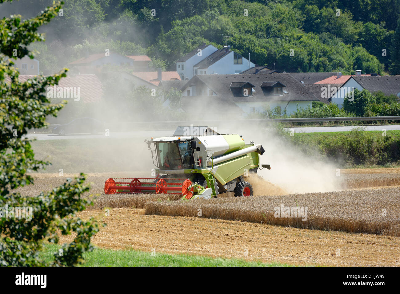 Germany, Upper Bavaria, Combine harvester in field of wheat Stock Photo ...