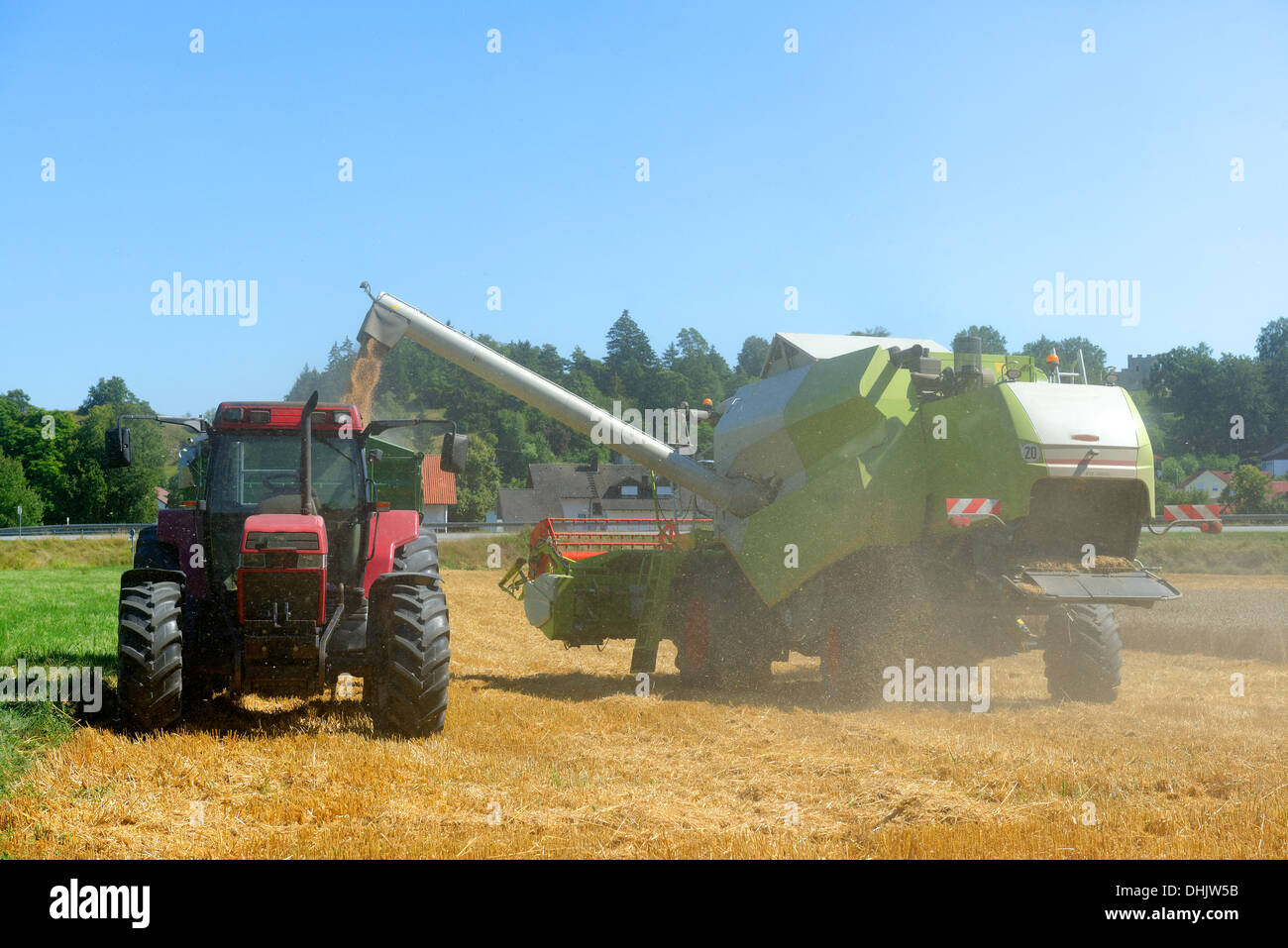 Germany, Upper Bavaria, Combine harvester in field of wheat Stock Photo ...