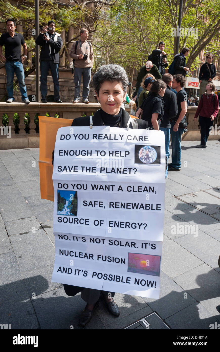 Protester advocating development of sustainable, renewable energy Stock ...