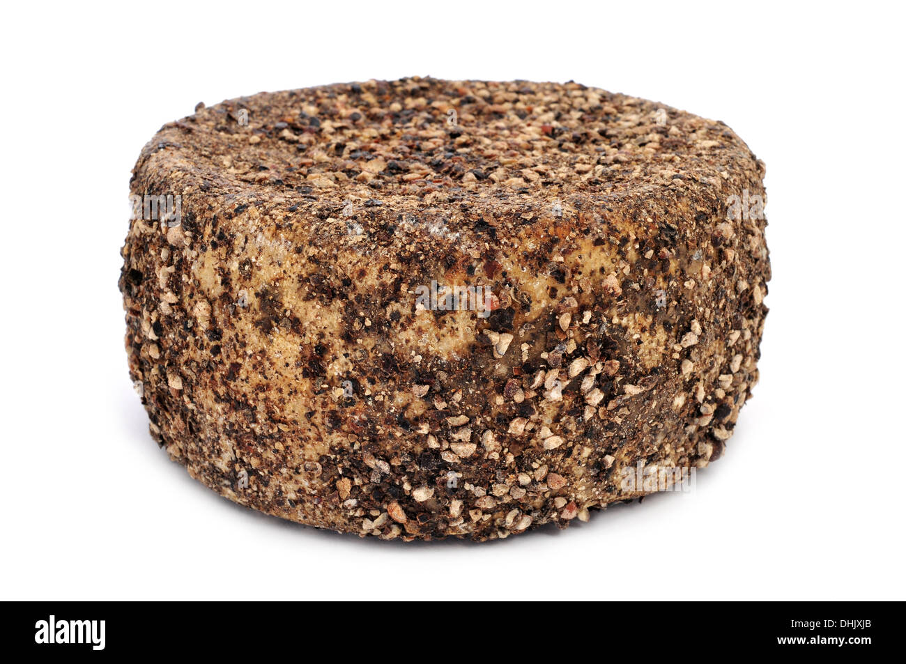 a handmade spice-coated cheese from Spain, on a white background Stock ...