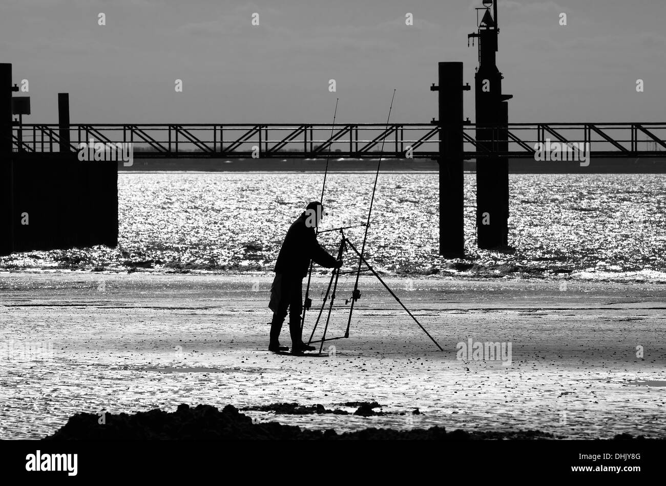 Sea angler fishing on Black and White Stock Photos & Images - Alamy