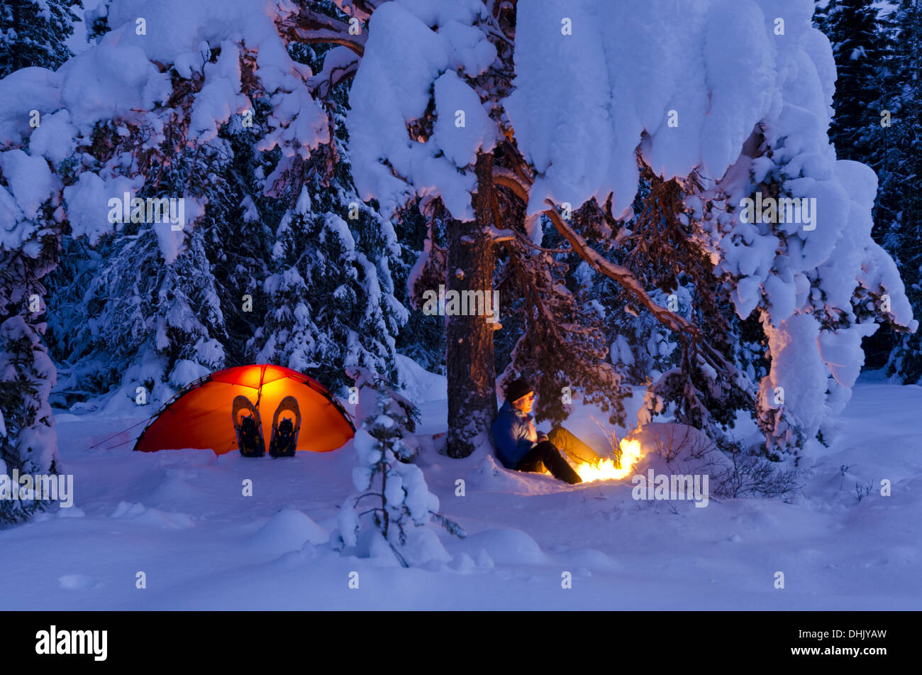 man with campfire and tent in snow, Norway Stock Photo - Alamy