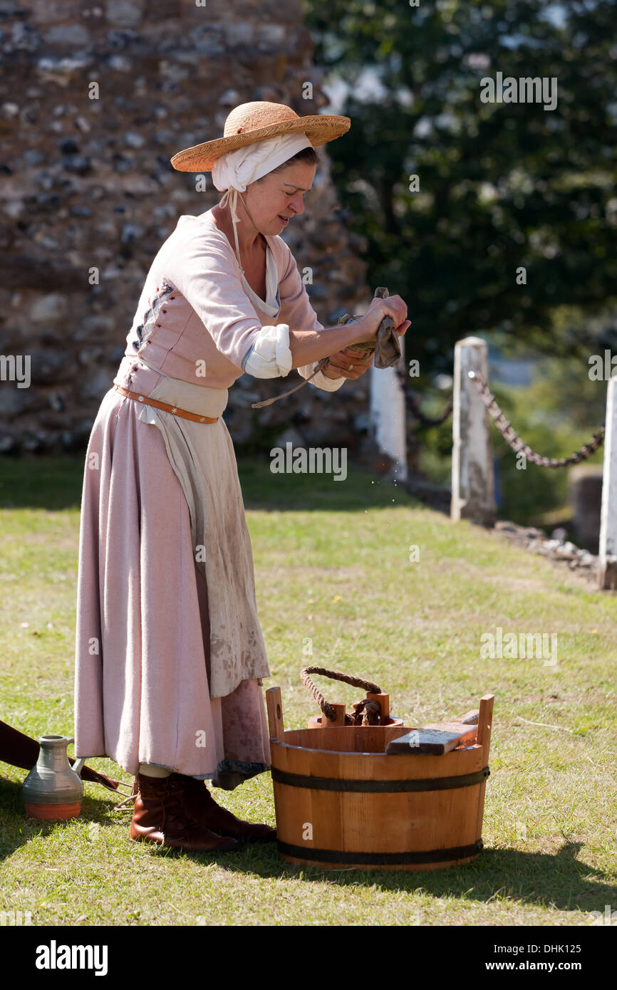 Woman in medieval costume washing in a wooden bowl Stock Photo - Alamy
