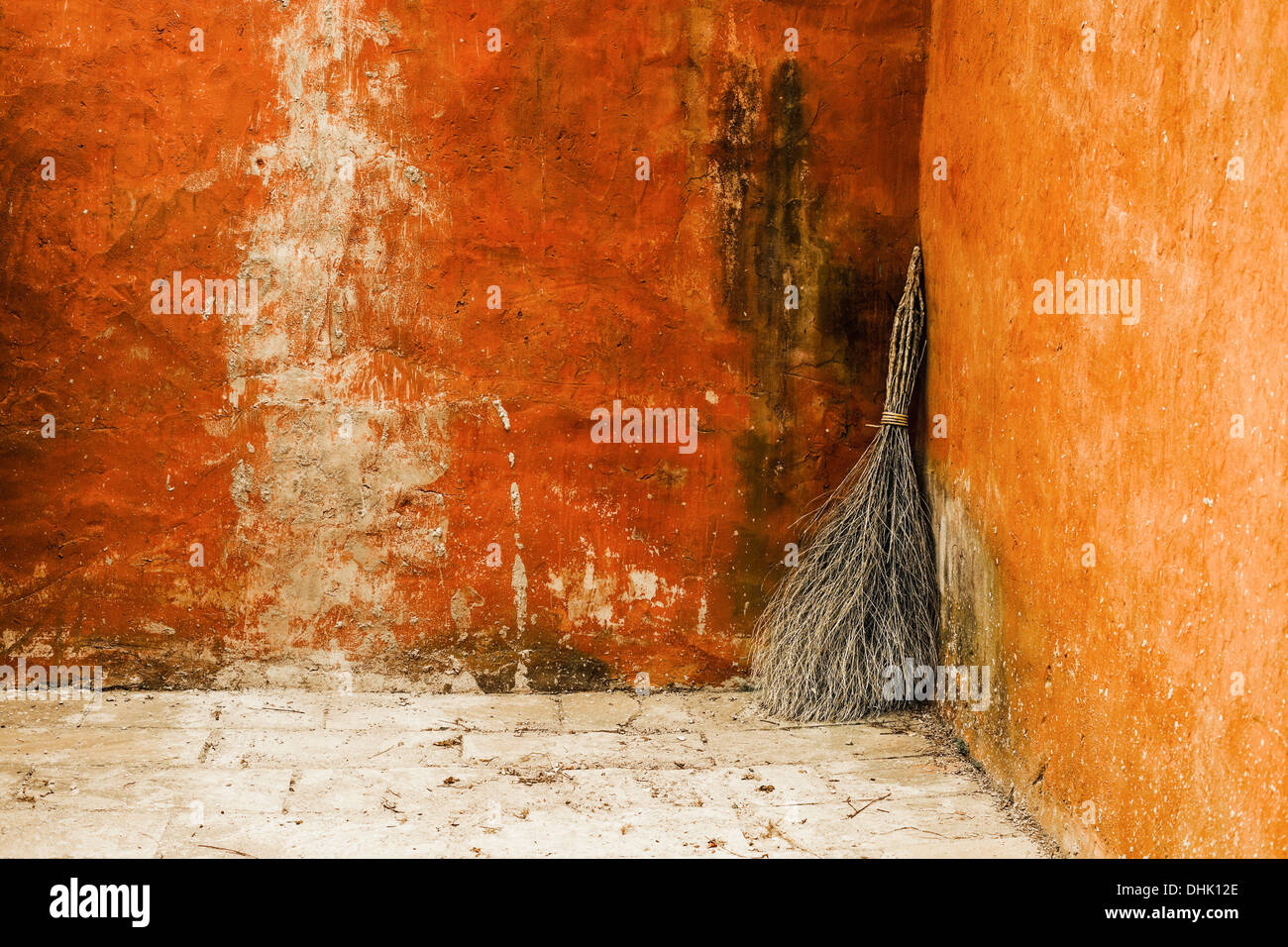 Broom leaning against the wall in a rural courtyard Stock Photo - Alamy