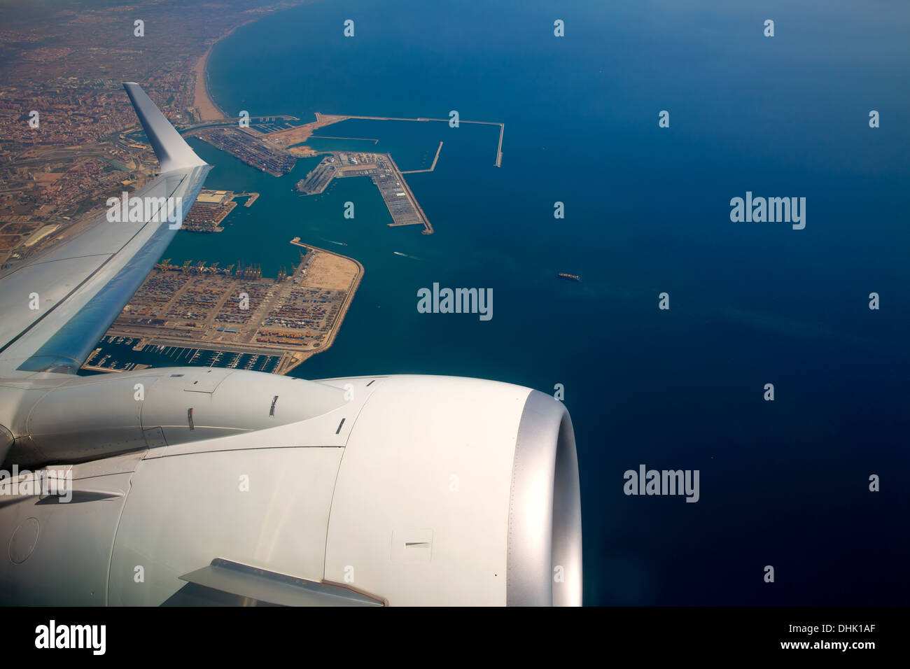 Airplane flying over Valencia port in Spain and Mediterranean Sea Stock ...