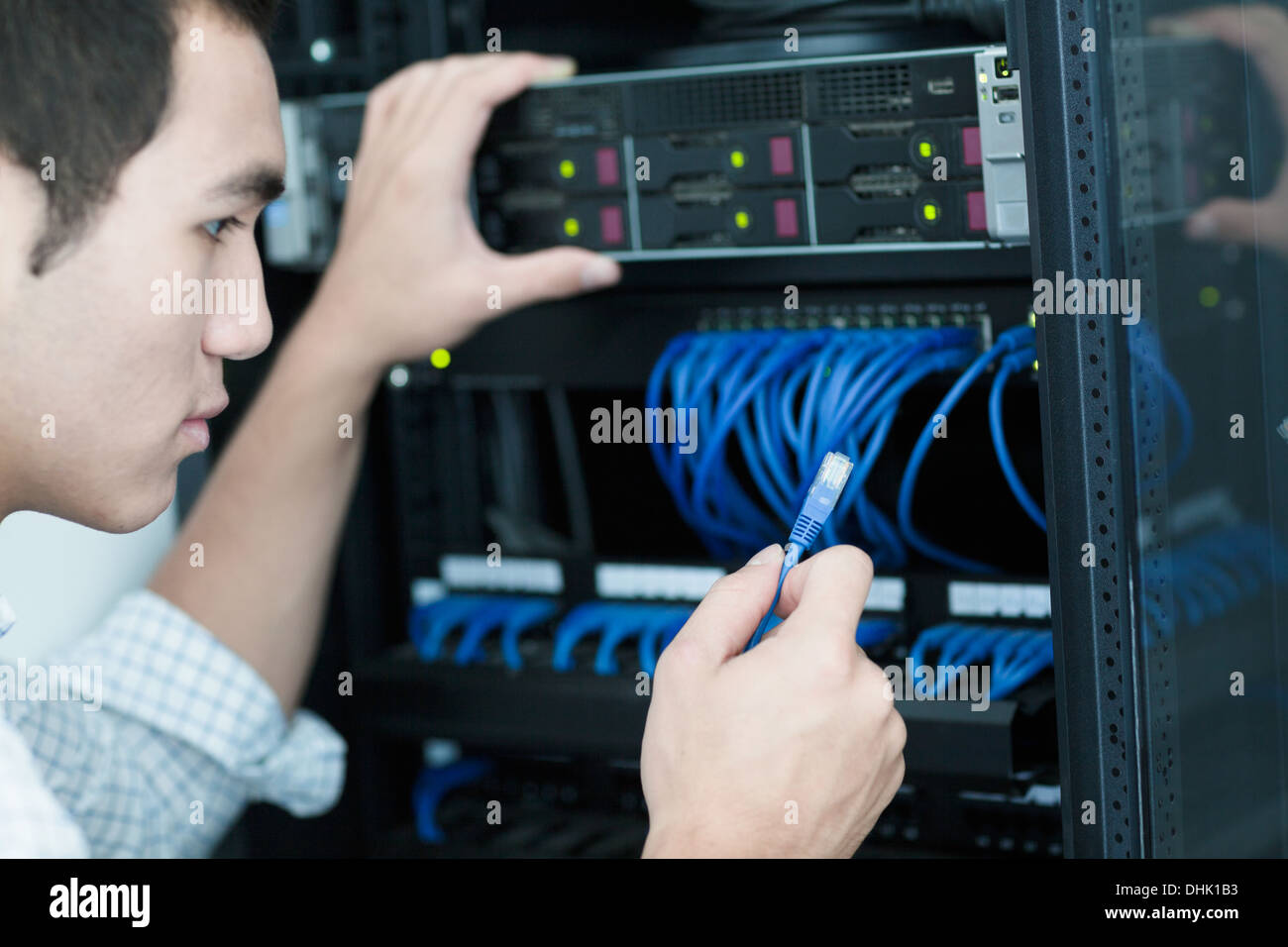 Plugging in cable hi-res stock photography and images - Alamy