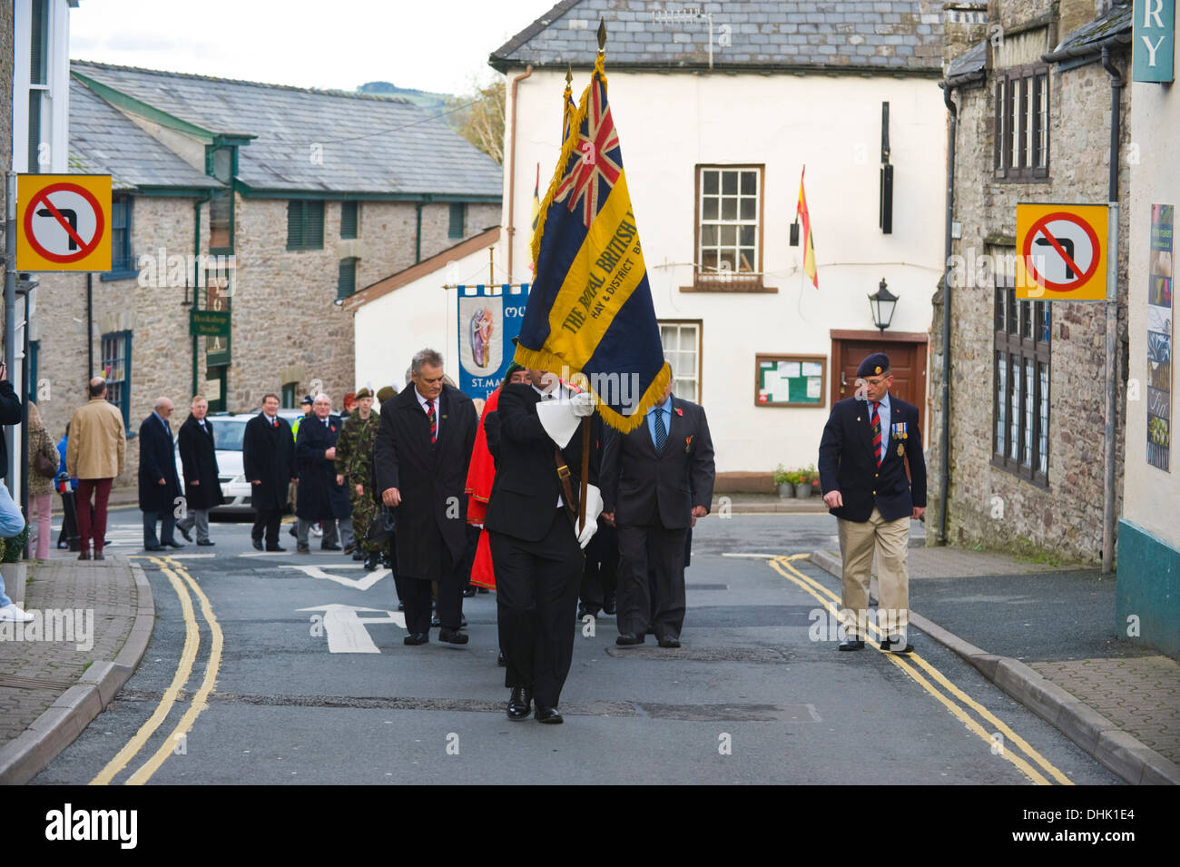 Remembrance Sunday parade with British Legion flags in front at Hay-on ...
