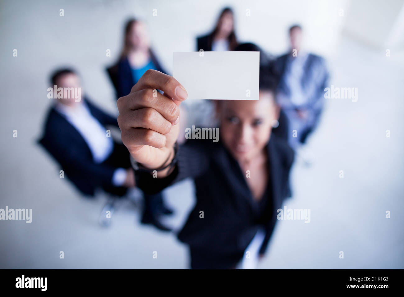 Businesswoman holding a business card up to the camera- Shannon Fagan ...