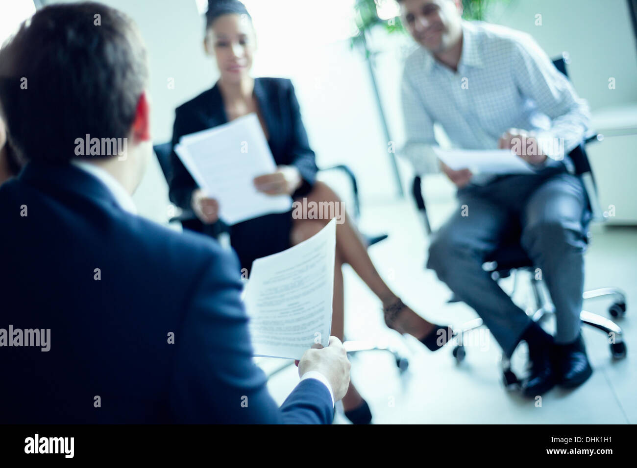 Business people sitting in a business meeting, tilt Stock Photo - Alamy