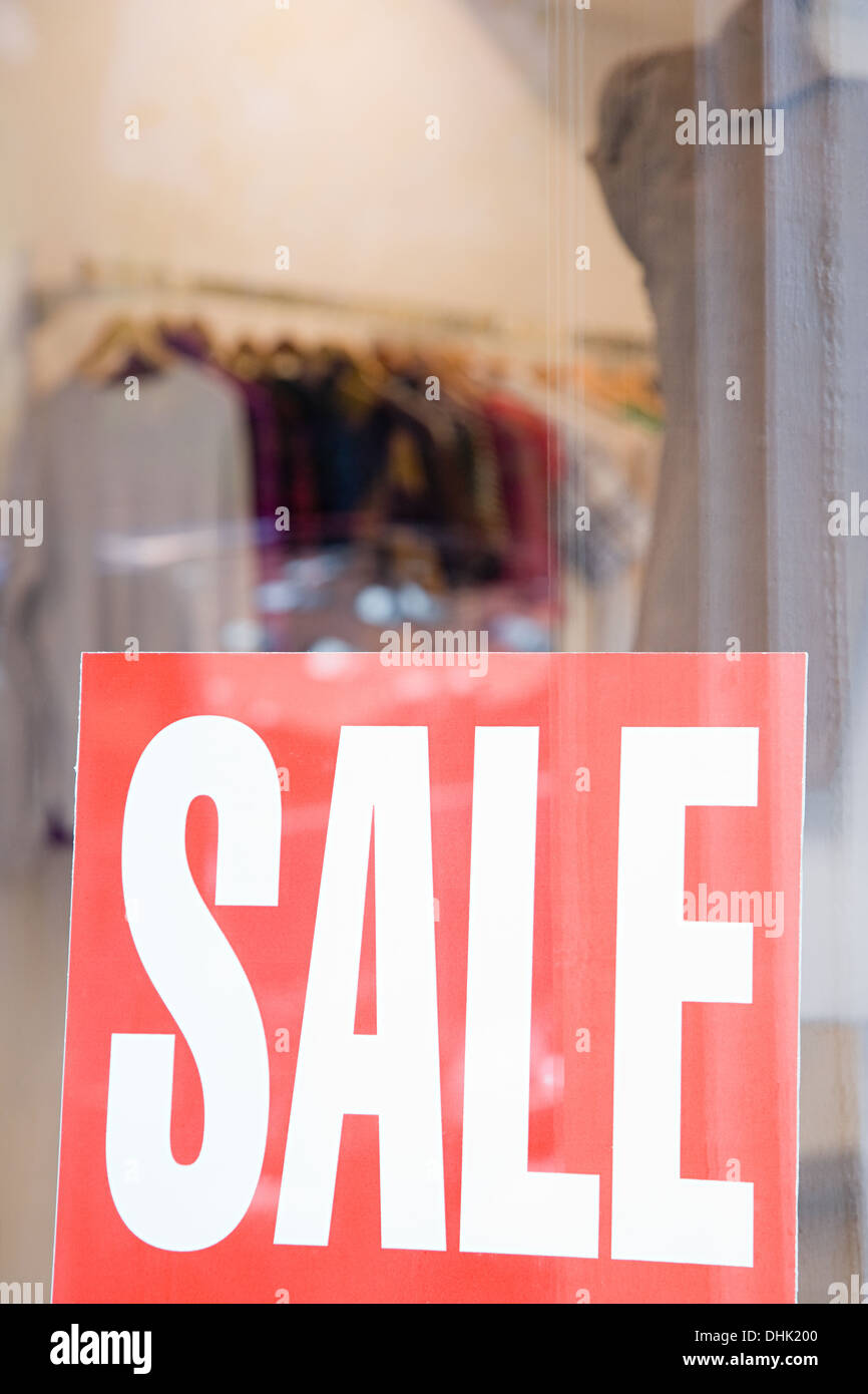 Sale sign in shop window Stock Photo - Alamy