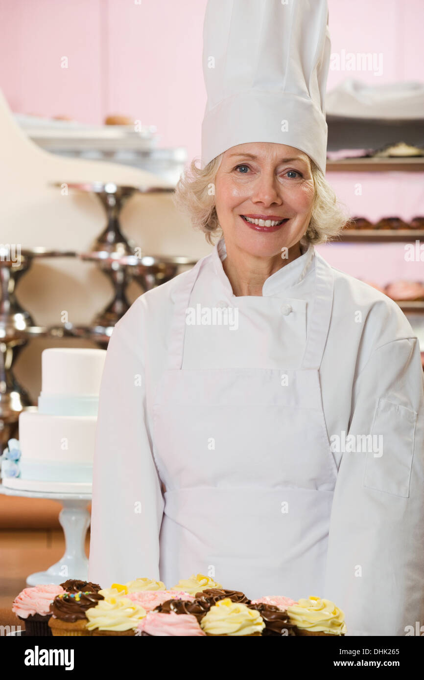Baker with cakes Stock Photo - Alamy
