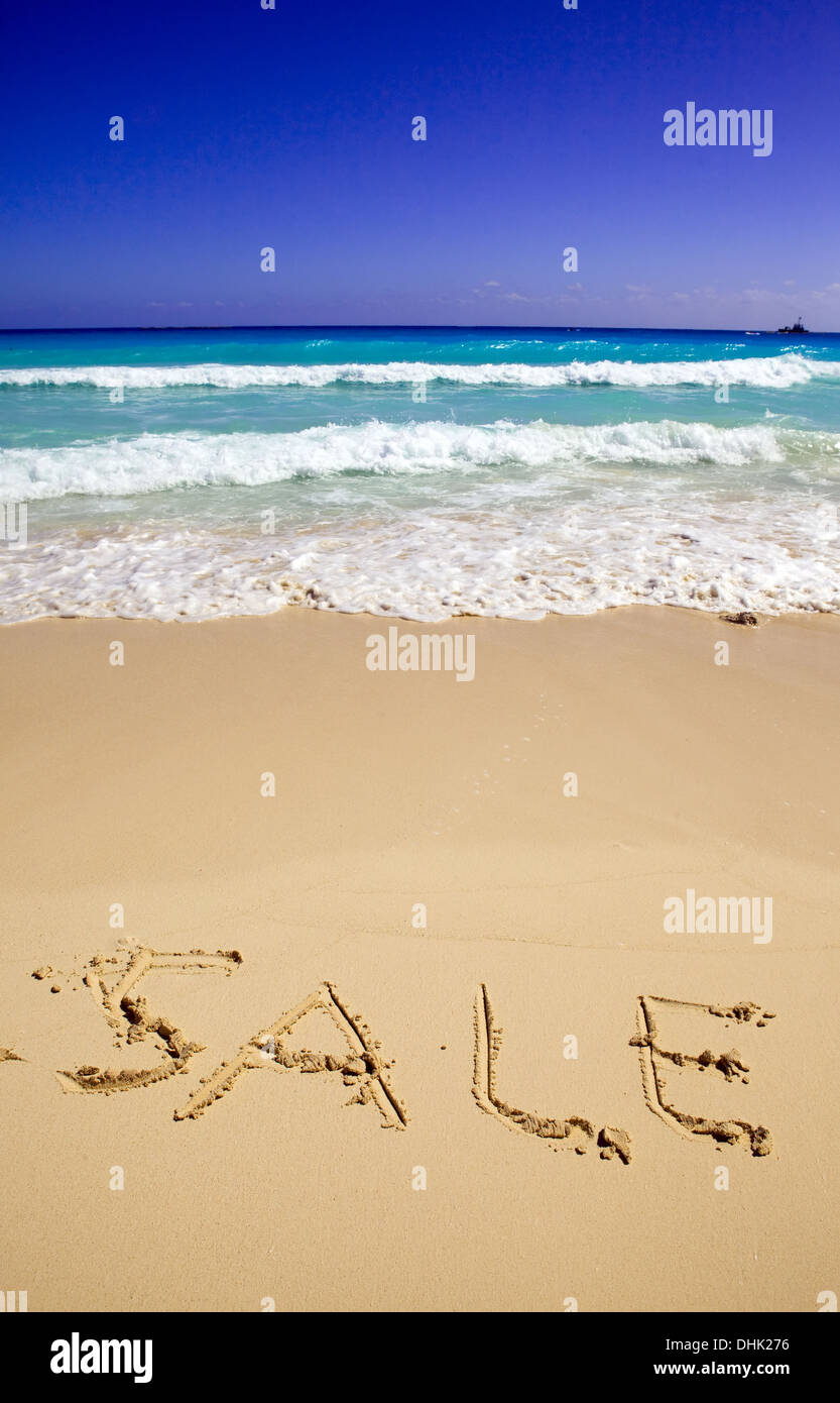 text on sand - sale Stock Photo - Alamy