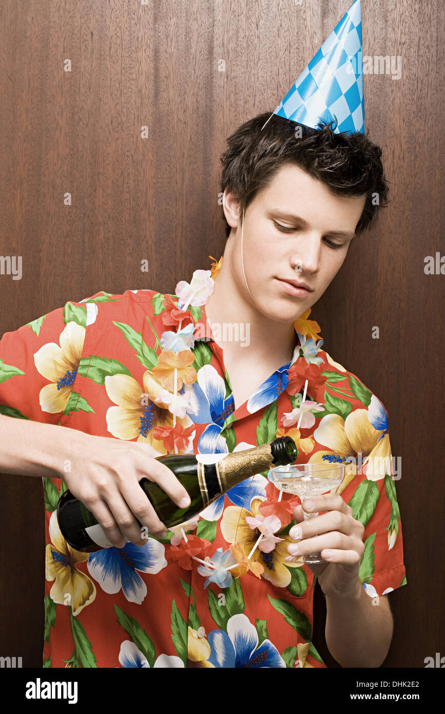 Businessman blowing party horn blower Stock Photo - Alamy