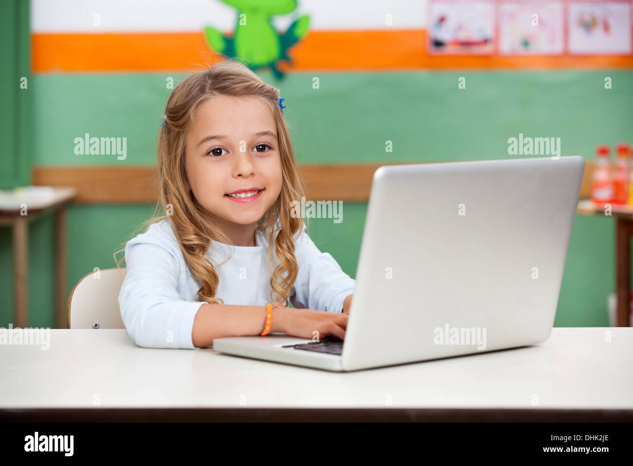 Girl Using Laptop In Classroom Stock Photo - Alamy