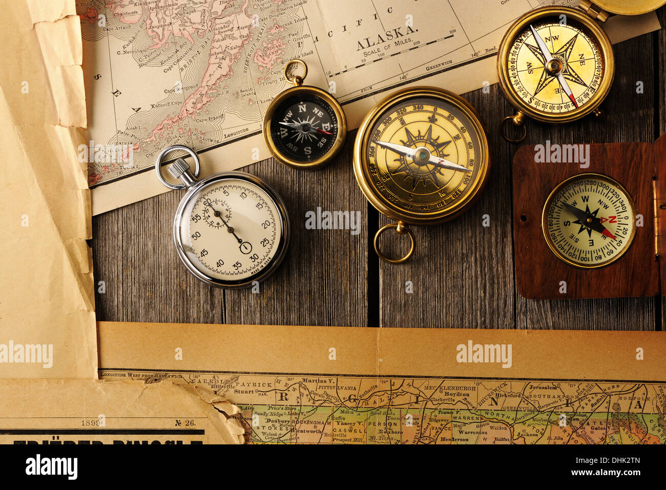 Antique compasses over old map Stock Photo - Alamy
