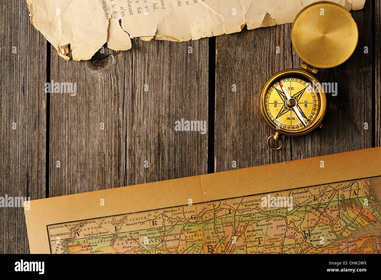Antique compass over old map Stock Photo - Alamy