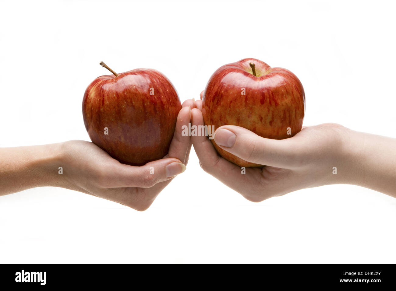 Two hands stretch each other apples Stock Photo - Alamy