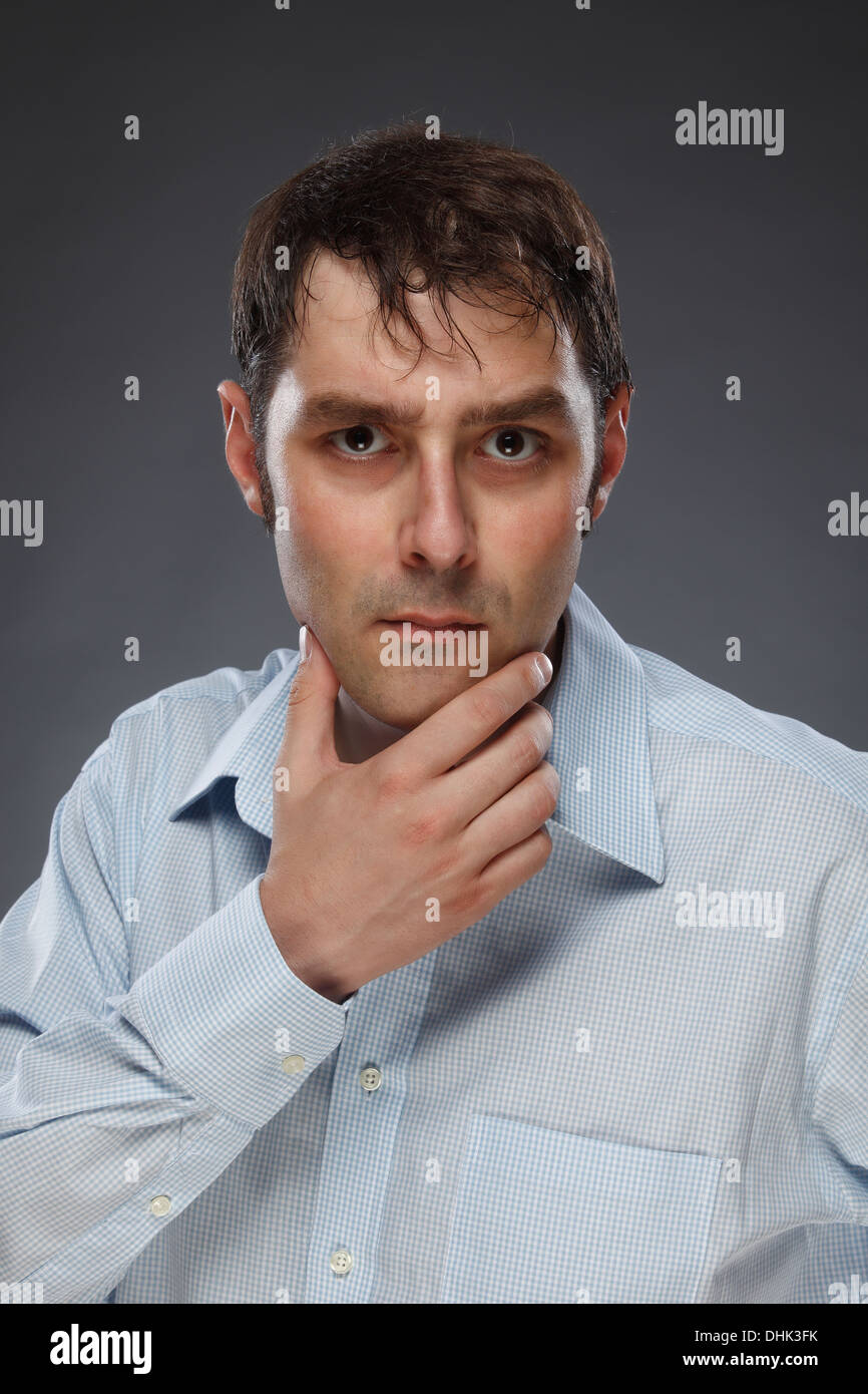 Portrait of critical man, studio shot Stock Photo - Alamy