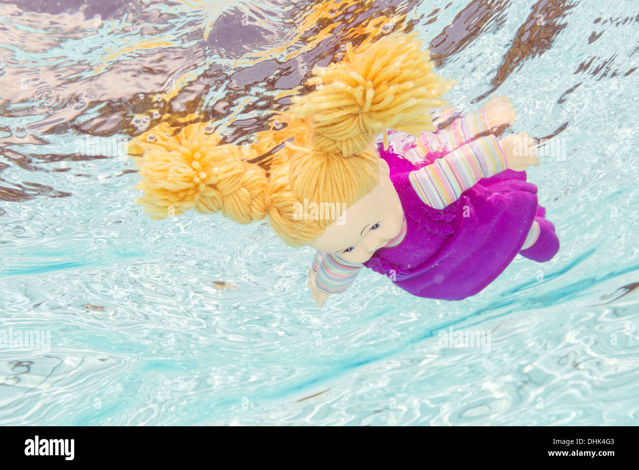 Doll floating in water in hi-res stock photography and images - Alamy