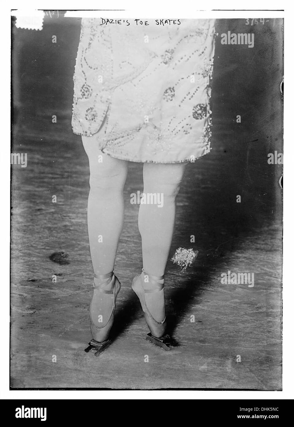 The image depicts a pair of toe skates, a piece of historical equipment ...