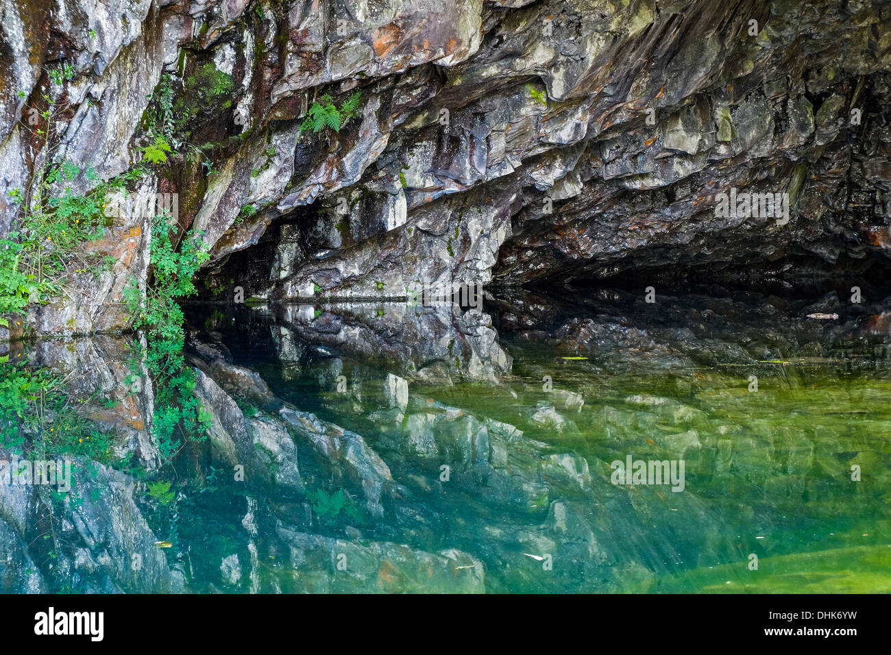 An image of Rydal Cave with a reflection of the walls of the cave in ...