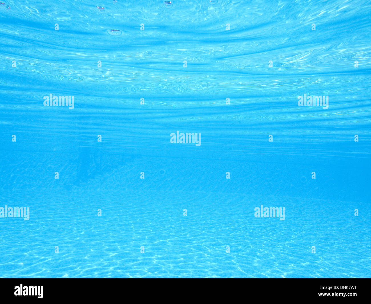 Underwater image of a swimming pool with light patterns on a sunny day ...