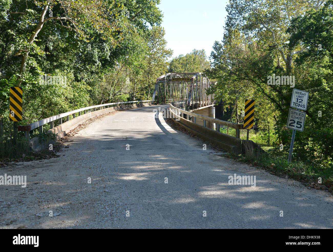 Old truss girder box bridge crosses a river on old Route 66 in rural ...