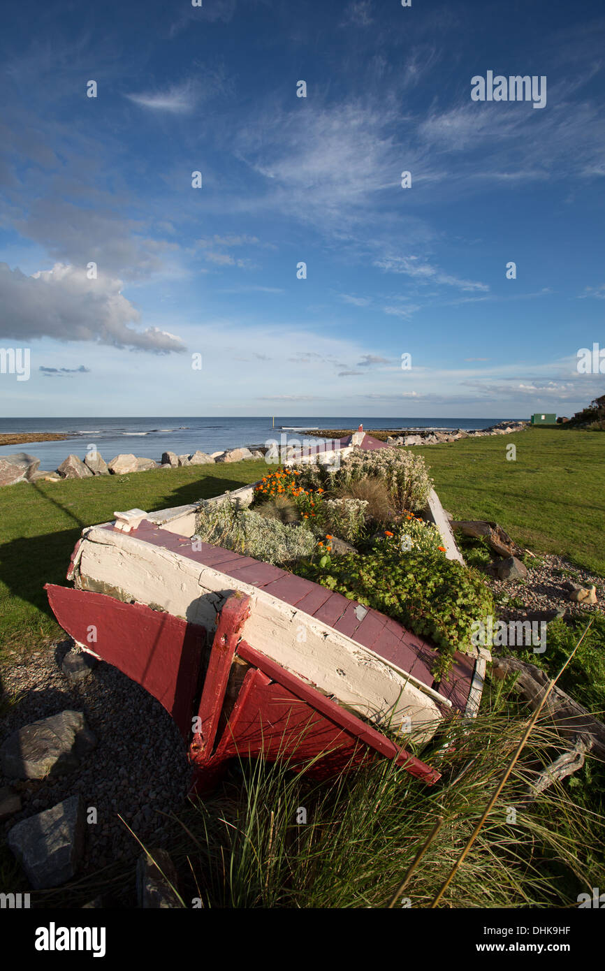 Village of Brora, Scotland. Picturesque view of an old boat on the ...