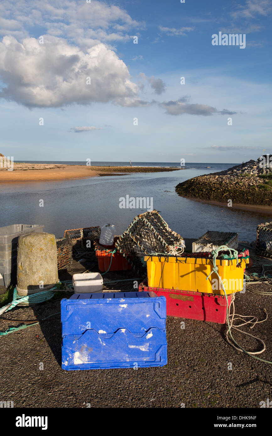 Village of Brora, Scotland. Empty fish crates and lobster pots at Brora ...