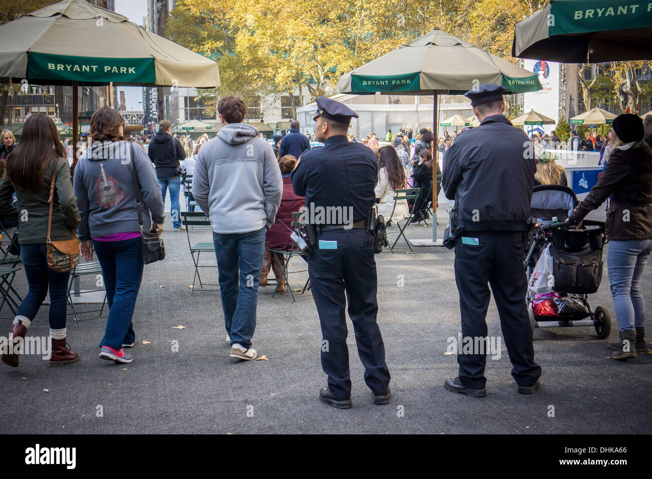 NYPD officers stand watch over the packed Winter Village at Bryant Park ...