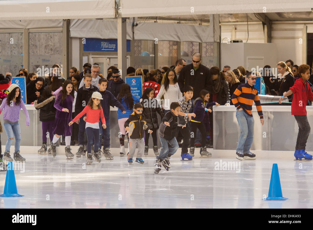 Skaters maneuver the packed Winter Village at Bryant Park ice skating ...
