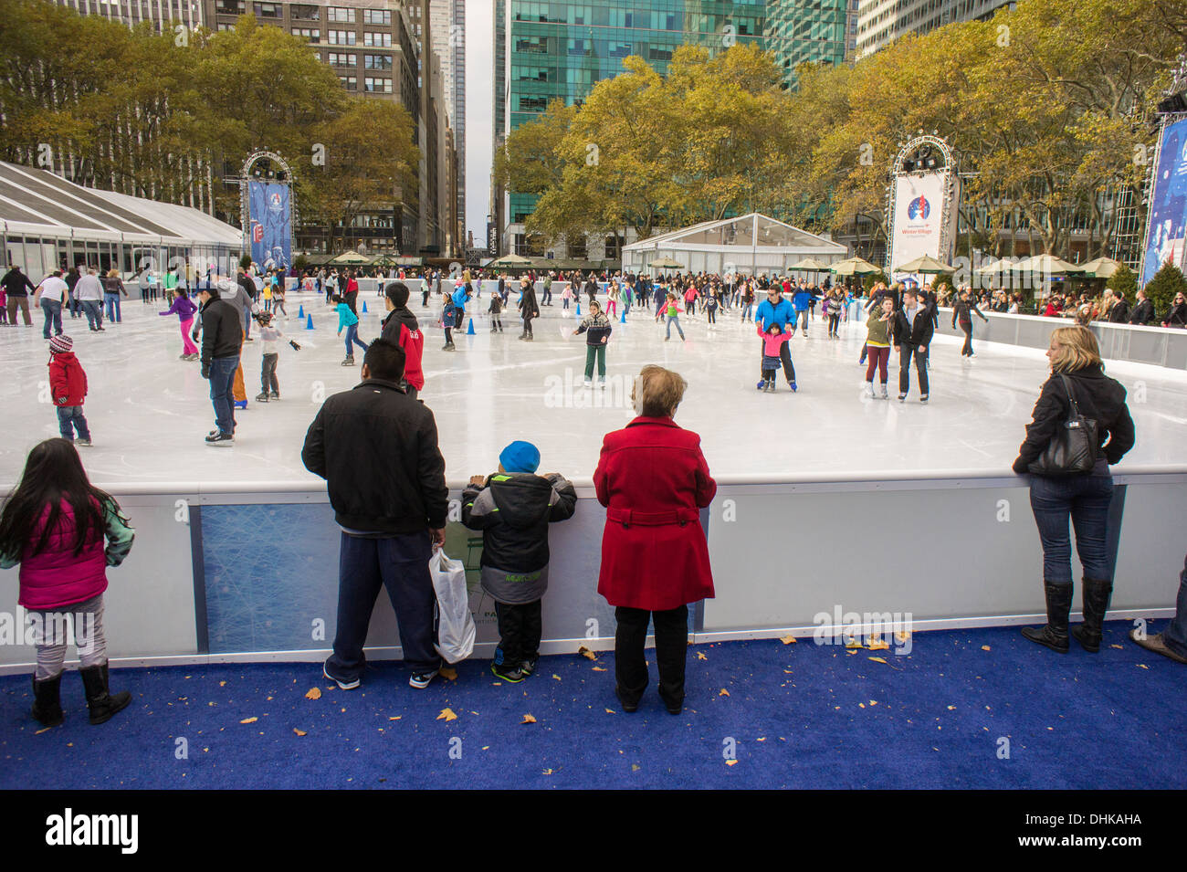 Skaters maneuver the packed Winter Village at Bryant Park ice skating ...