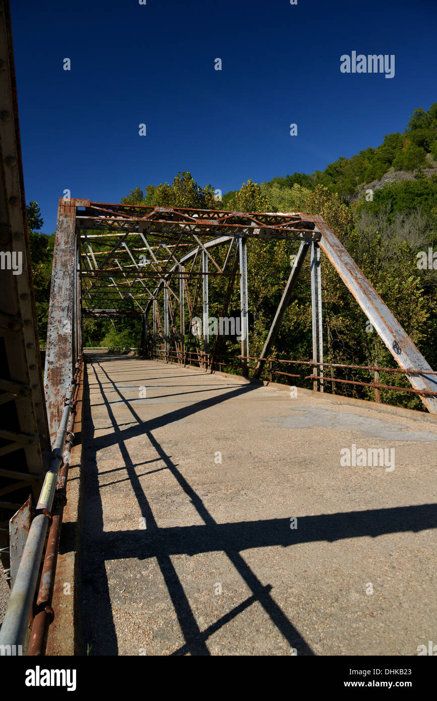 Old truss girder box bridge crosses a river on old Route 66 in rural ...