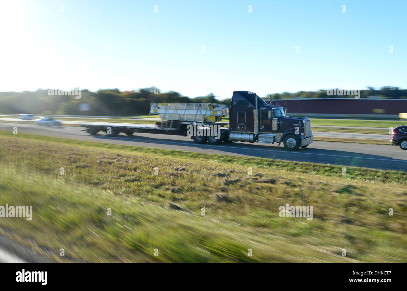 Big Rig American Semi trailer articulated tanker truck speeds along the ...