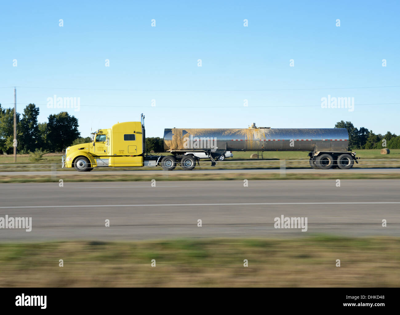 Big Rig American Semi trailer articulated tanker truck speeds along the ...