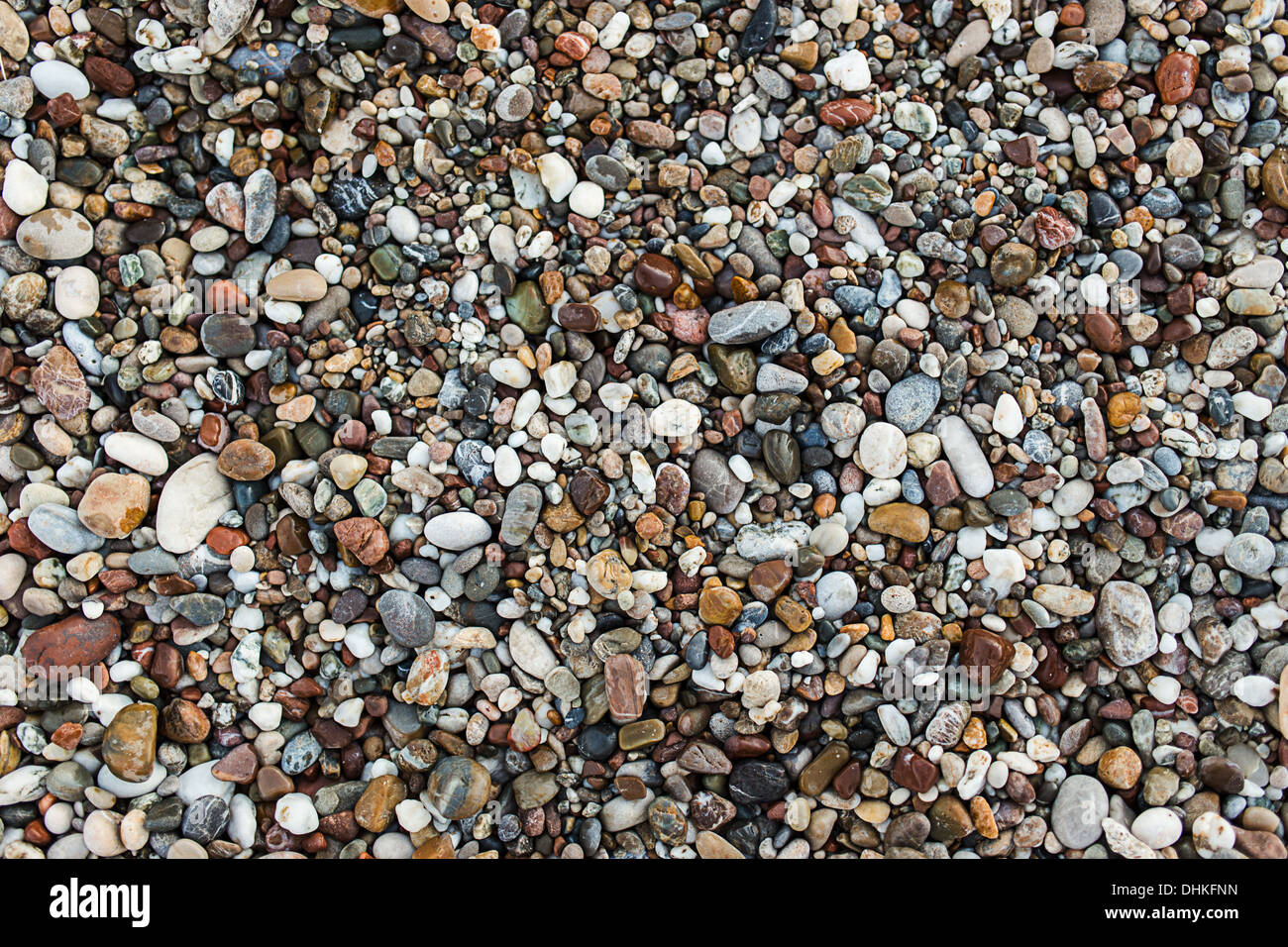A close up view of different rounded smooth polished pebble stones on ...