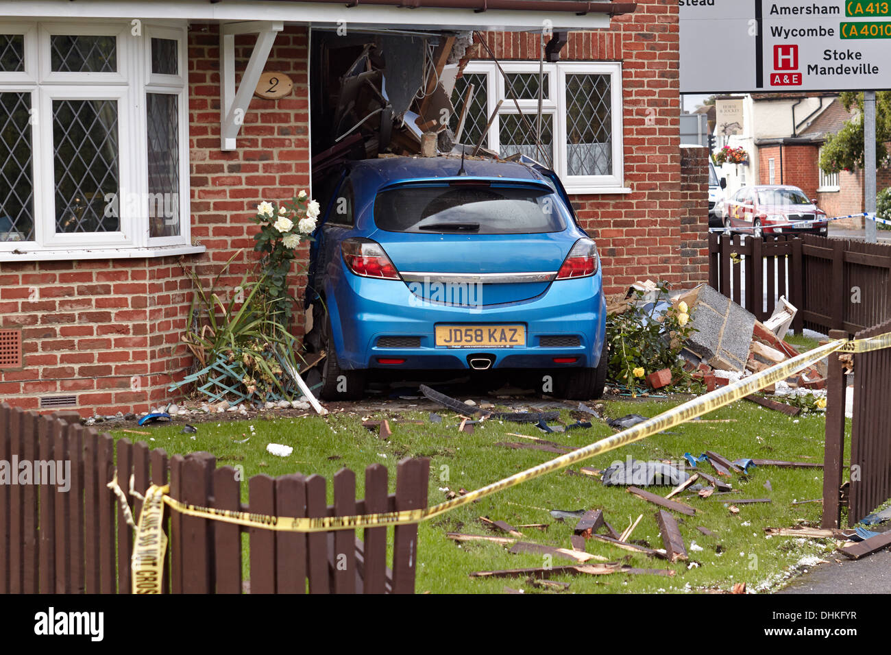 A blue car crashed into a house causing extensive damage Stock Photo ...