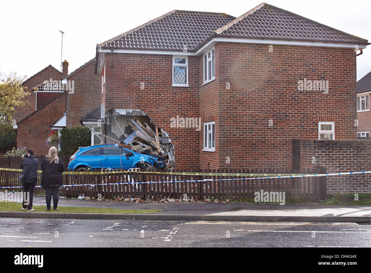 A blue car crashed into a house causing extensive damage Stock Photo ...