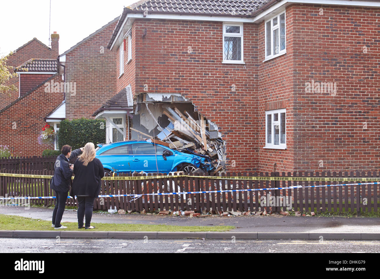 A blue car crashed into a house causing extensive damage Stock Photo ...