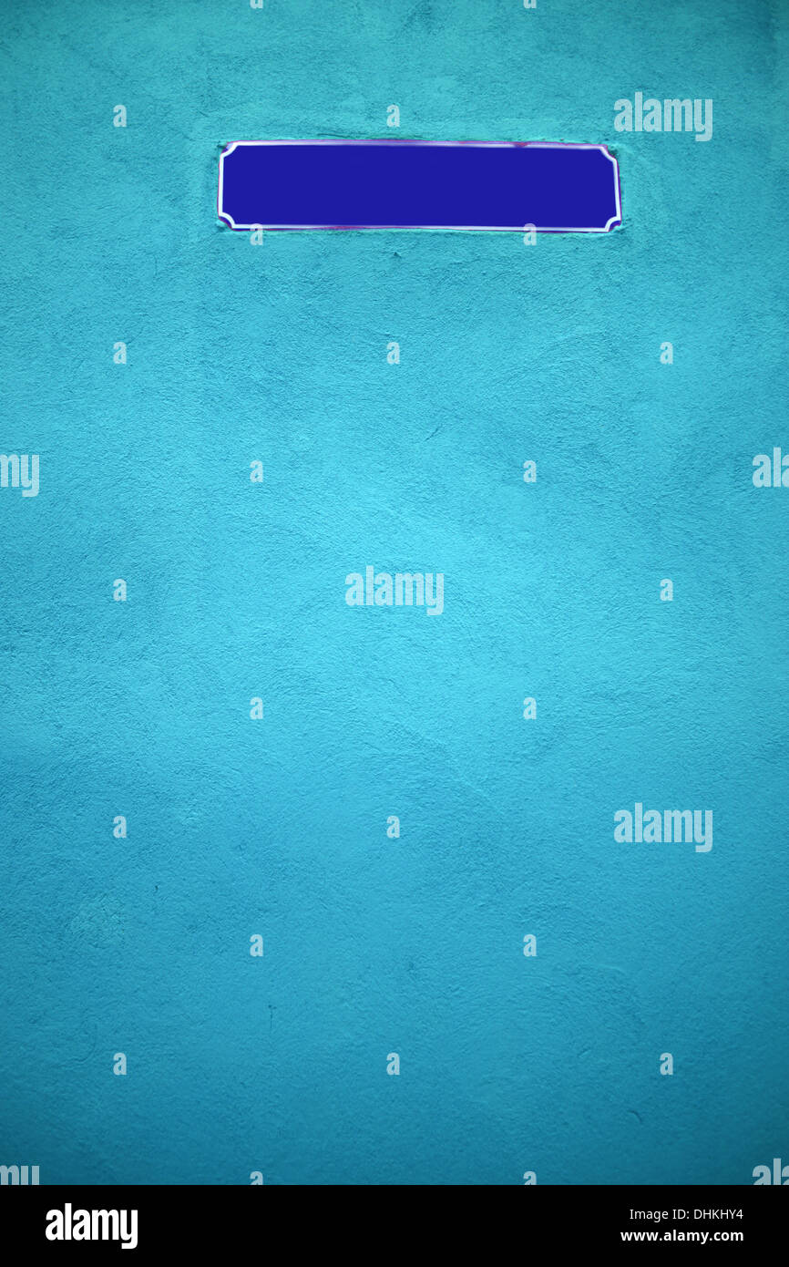 Color shot of an empty blue street sign on a blue wall Stock Photo - Alamy