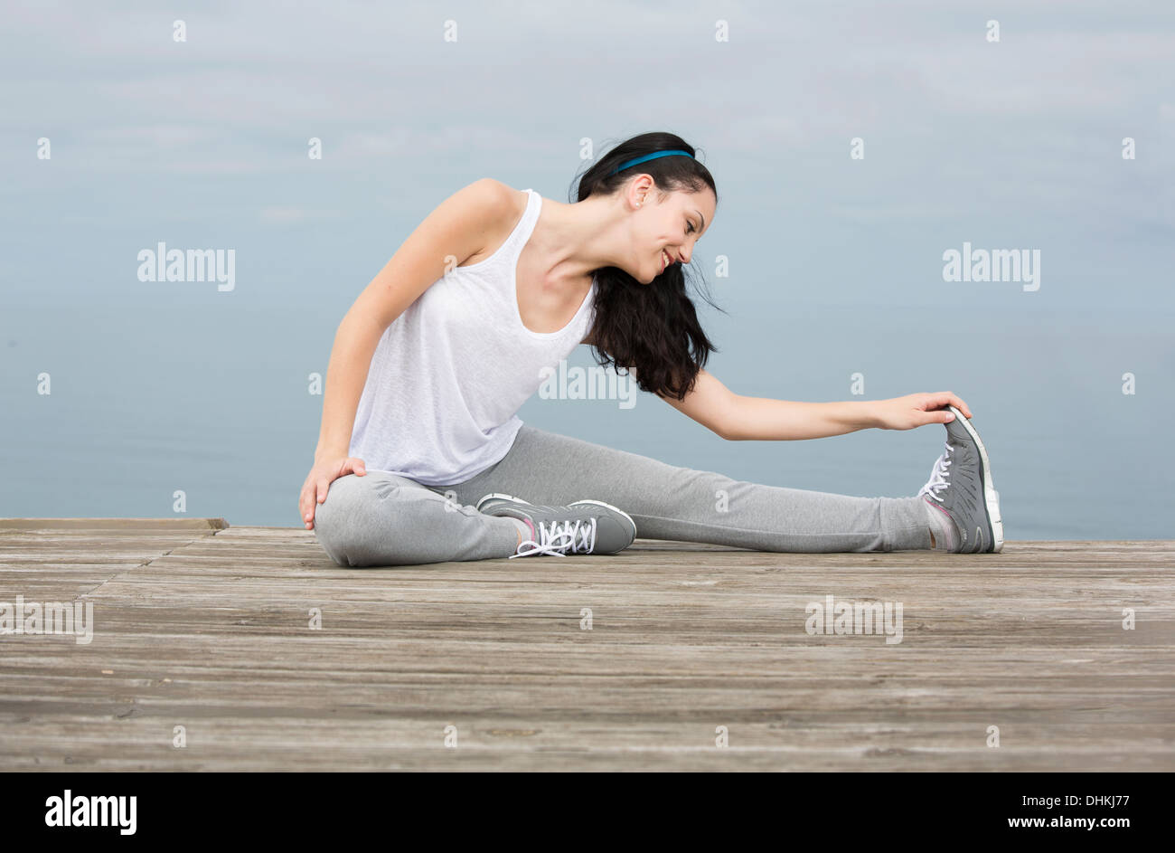 Beautiful young woman doing outdoor morning exercises Stock Photo - Alamy