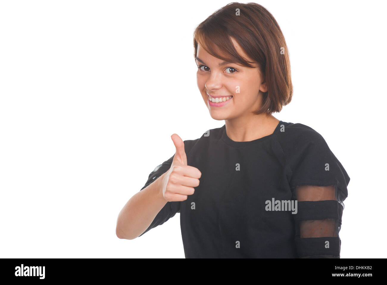 Teenage girl showing thumbs up and smiling Stock Photo - Alamy