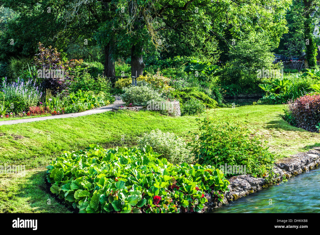 The pretty landscaped garden of the Trout Farm in the Cotswold village ...