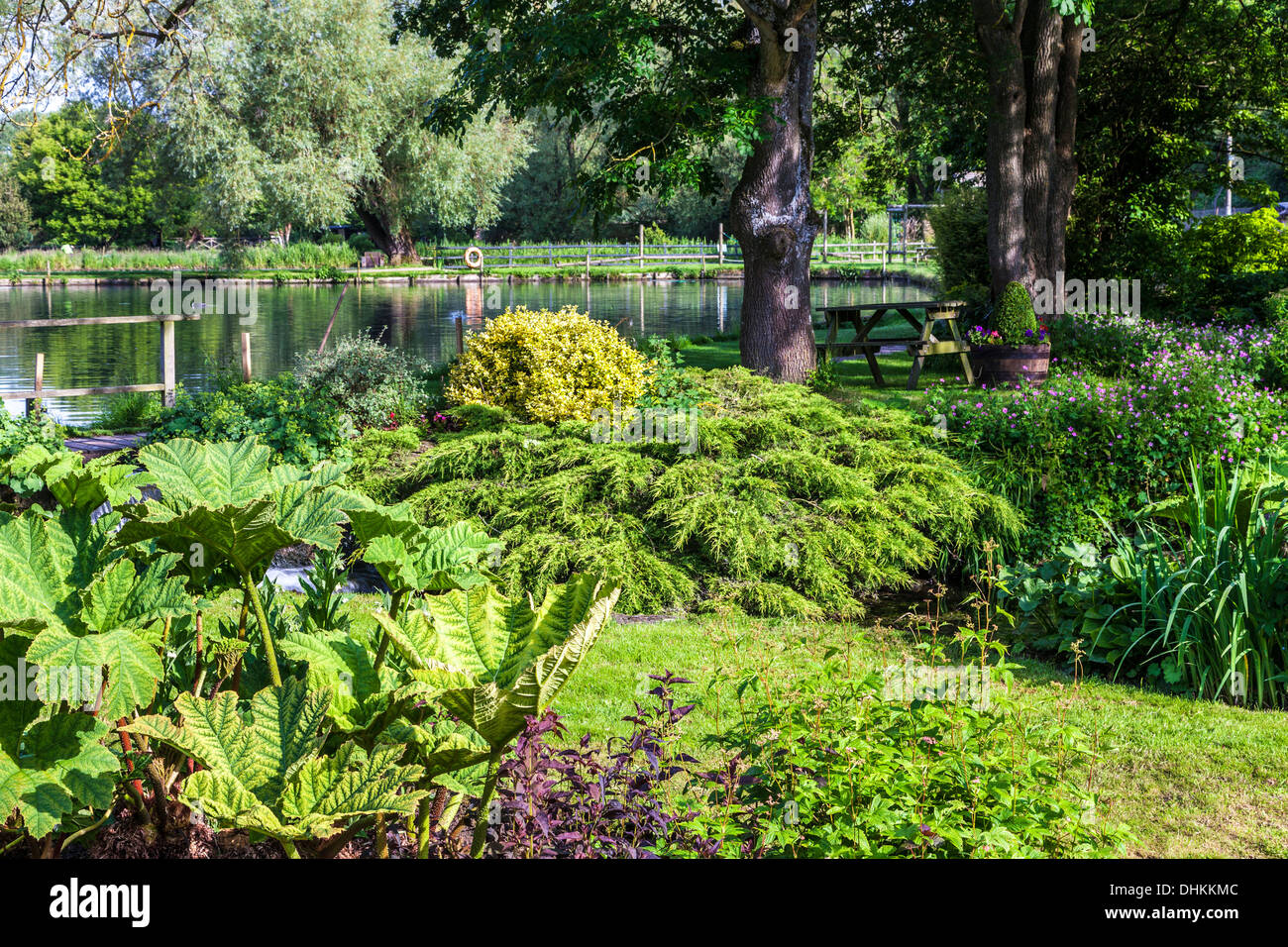 The pretty landscaped garden of the Trout Farm in the Cotswold village ...