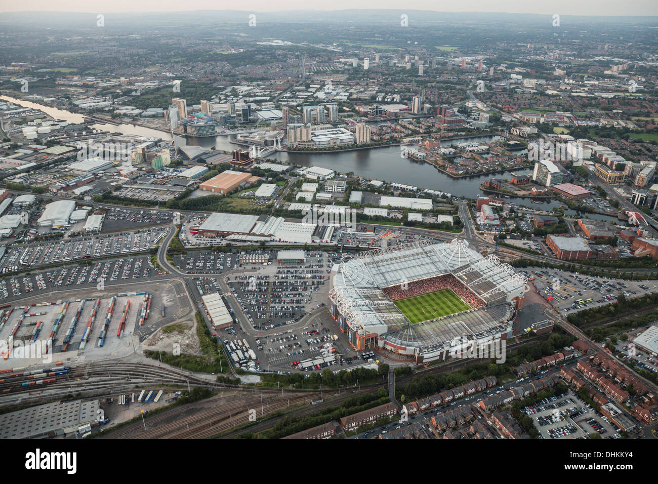 Twilight aerial view over Manchester with Old Trafford Football and ...