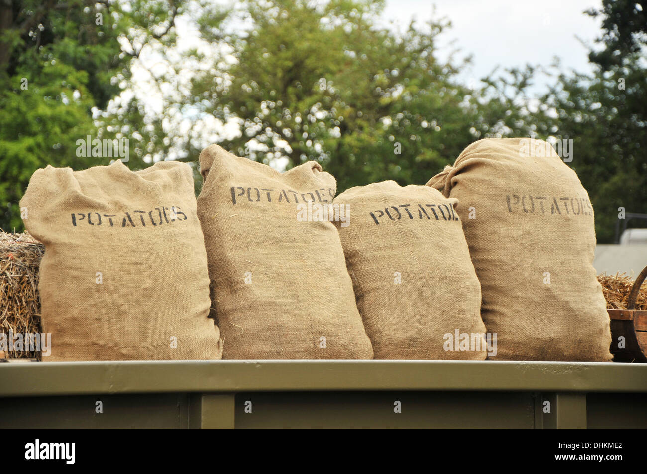 Four sacks of fresh potatoes, in a row on the back of a lorry Stock ...