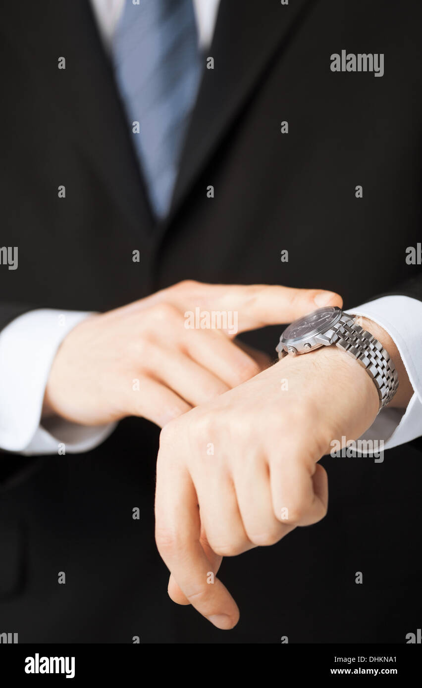 Man looking watch rushing work hi-res stock photography and images - Alamy