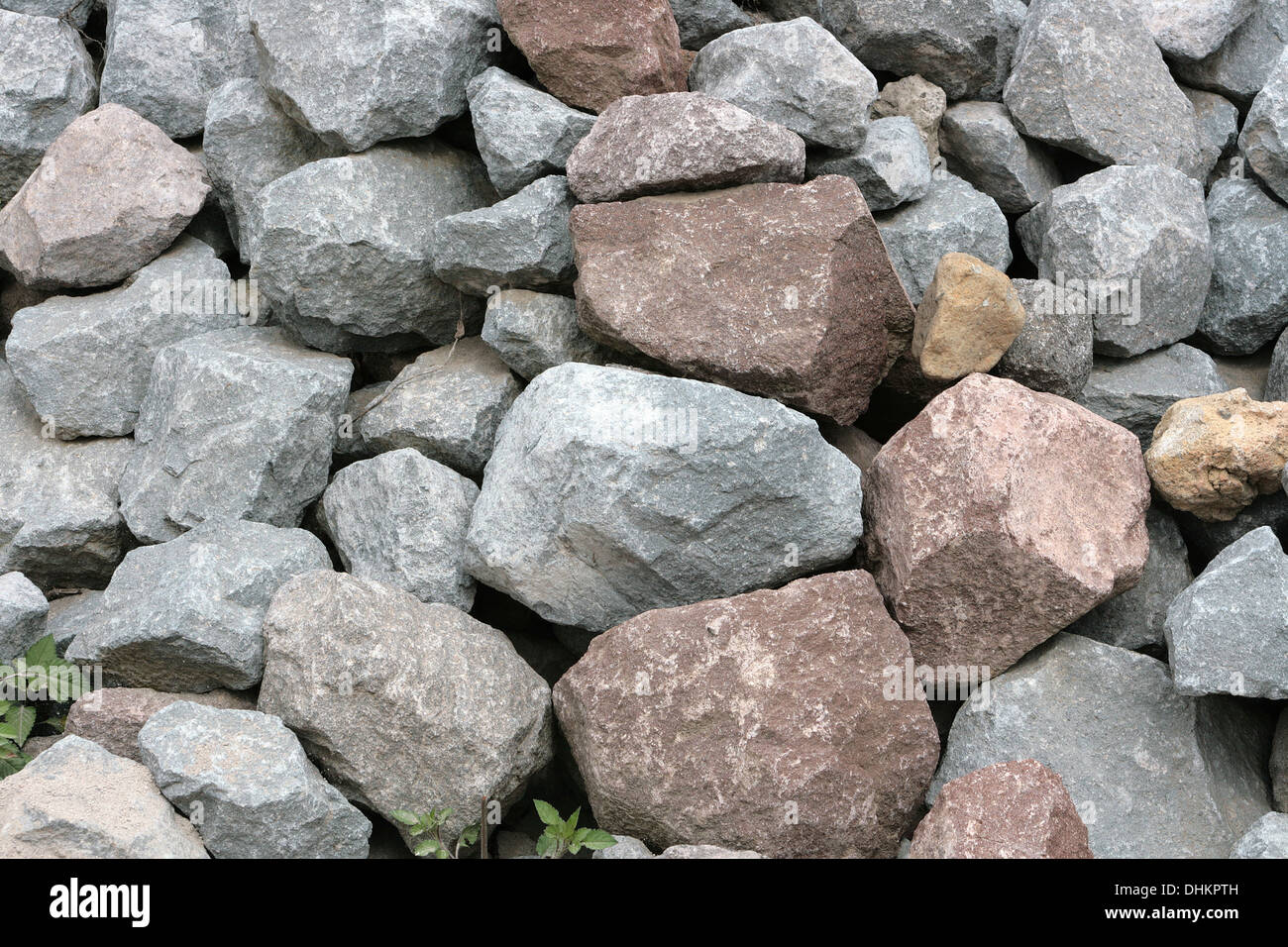 A pile of rocks in a variety of shapes and colors at a construction ...