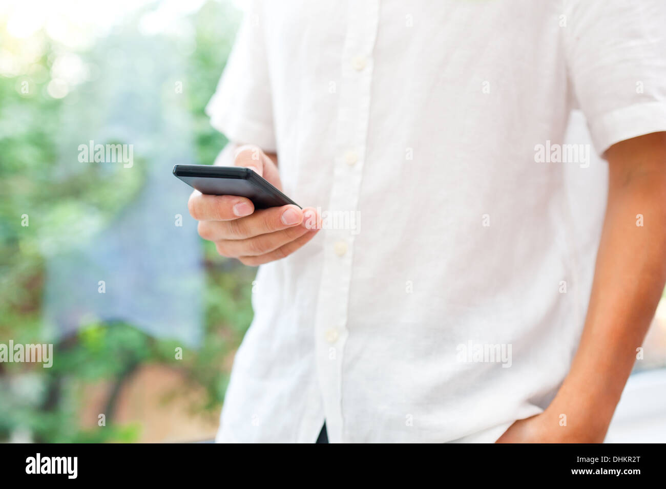 Man hand phone home hi-res stock photography and images - Alamy